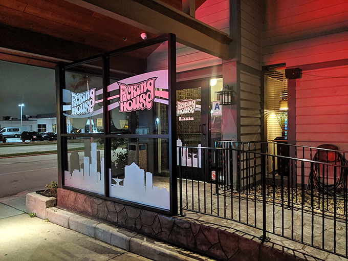 The entrance glows with pink neon promise, like a portal to a world where calories don't count and fish fries are forever.