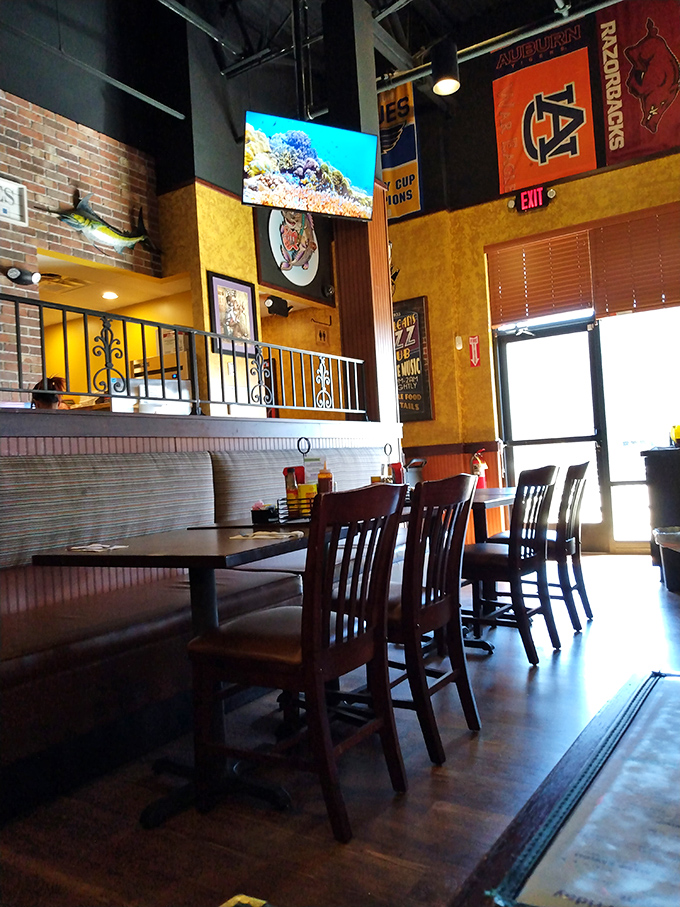 College pennants and seafood d&eacute;cor create that rare sweet spot between sports bar and fish shack that somehow feels exactly right.