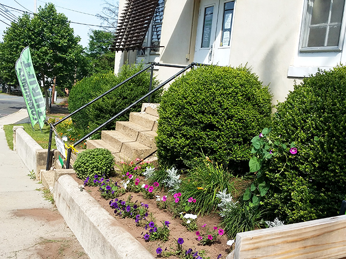 Welcoming flower beds greet visitors with a pop of color. Even the landscaping says "come in and find something wonderful!"