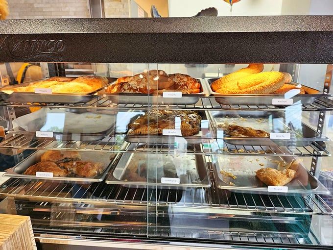 The pastry case&mdash;where willpower goes to die and "I'll just have a small piece" becomes the day's biggest fiction.