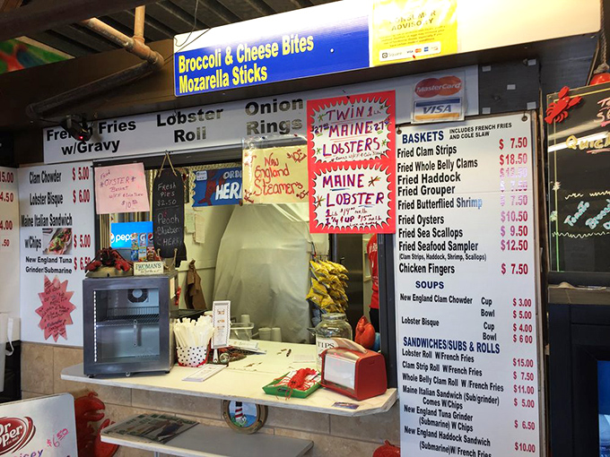 This seafood stand's menu reads like a New England coastal tour, bringing Maine lobster rolls to hungry Florida shoppers between bargain hunts.