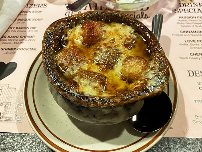 French onion soup that bubbles with promise under a golden cheese canopy. This isn't just soup&mdash;it's a warm hug in a crock on a chilly day.