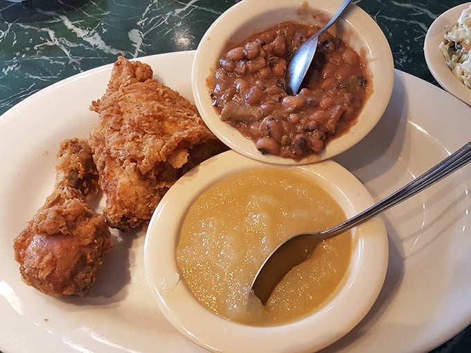 Fried chicken with the golden ratio of crunch to juiciness, accompanied by baked beans and applesauce that taste like childhood memories.