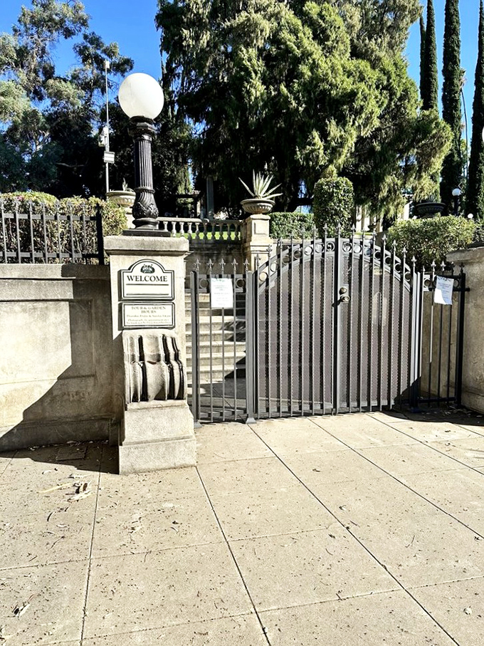 The entrance gate stands like a formal introduction to wonderland, complete with globe lamps that have illuminated visitors' first impressions for generations.