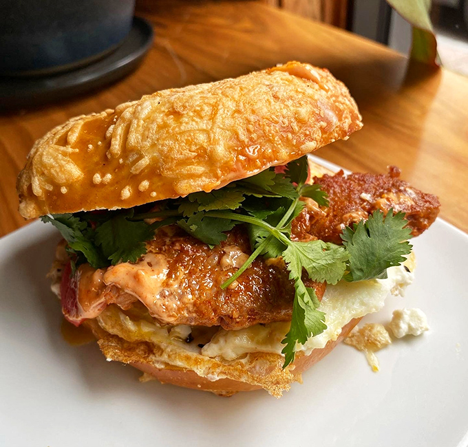 Sandwich architecture at its finest: layers of flavor stacked with artistic precision. That cilantro isn't just garnish&mdash;it's the exclamation point on a delicious sentence.