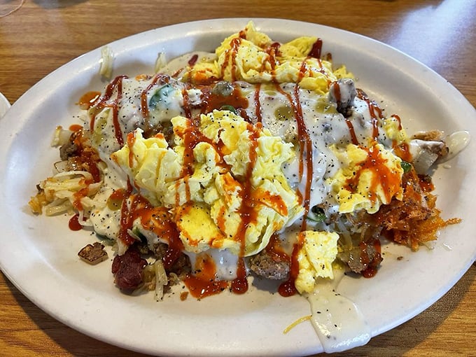 Breakfast nirvana achieved: crispy-edged hash browns smothered in gravy, with eggs and all the fixings in a glorious morning mash-up.