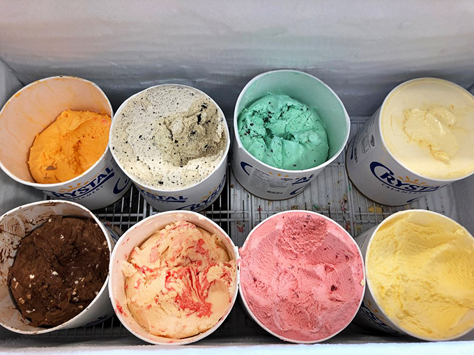 Eight tubs of ice cream standing at attention like colorful soldiers ready to battle your diet resolutions. The mint chip is particularly persuasive.