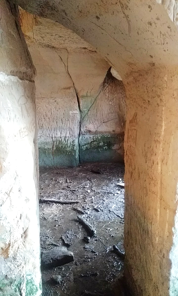 The interior reveals rooms within rooms, a sandstone labyrinth where pioneers once stored provisions and perhaps a few frontier secrets.