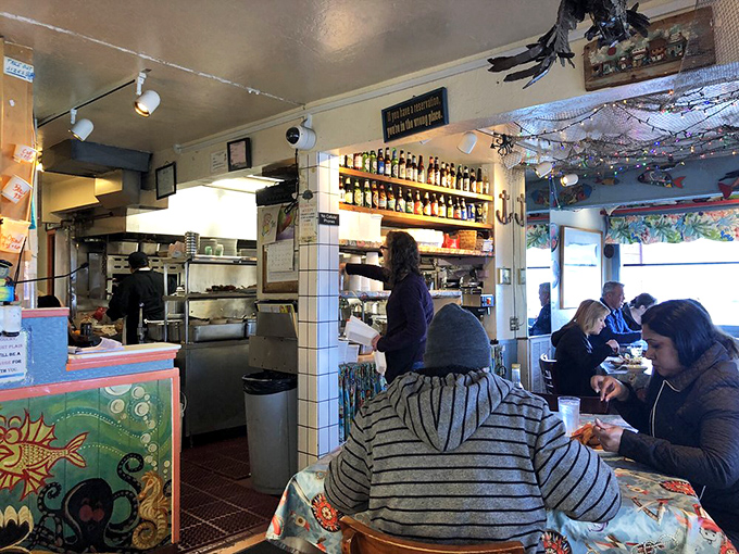Where seafood magic happens. The bustling kitchen and counter area showcase the no-nonsense approach that makes Barbara's special.