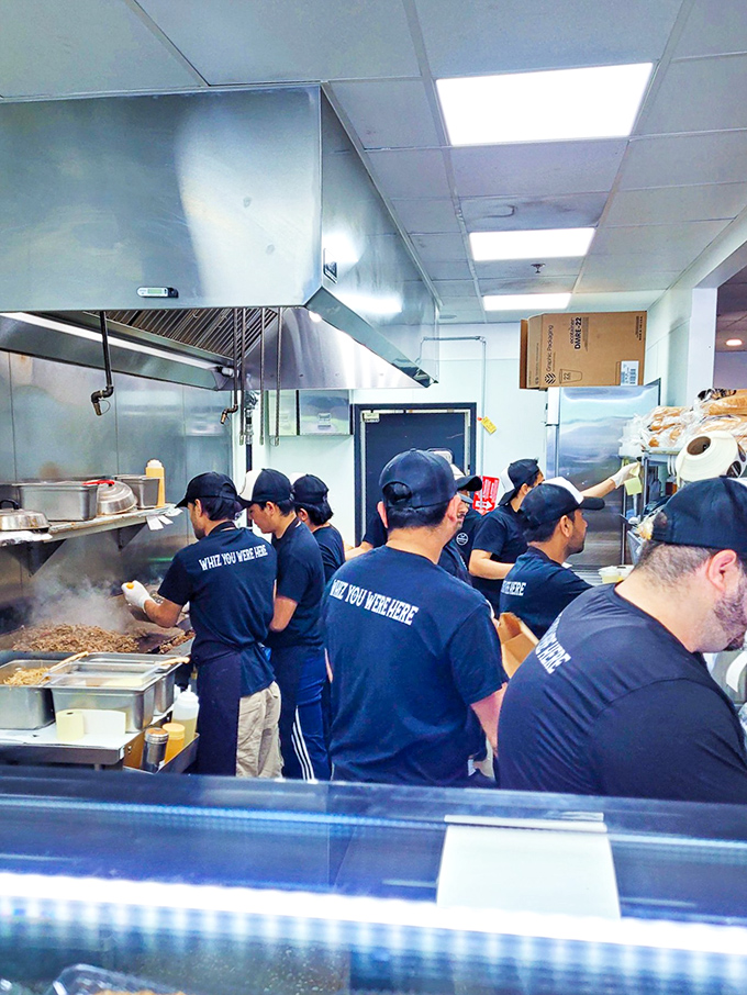 The kitchen crew in action, wearing shirts that ask "Wish YOU were HERE" &ndash; and based on what they're cooking, yes, we absolutely do.