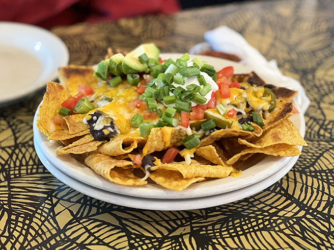 These loaded nachos aren't just an appetizer; they're a social event disguised as a shareable plate&mdash;though sharing is entirely optional.