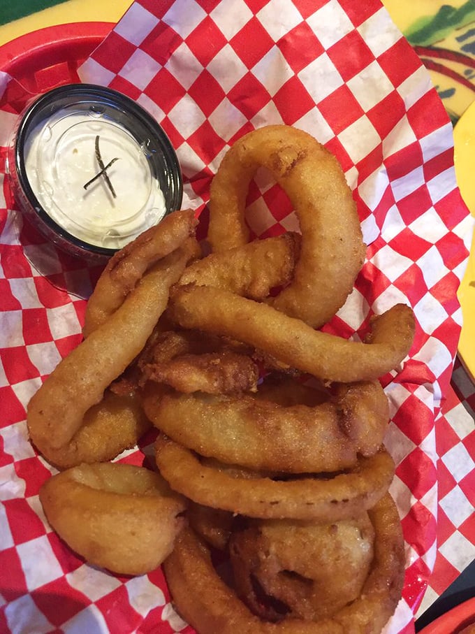 Onion rings with structural integrity that engineers would admire. Crispy, golden hoops of happiness that make the perfect shareable starter.