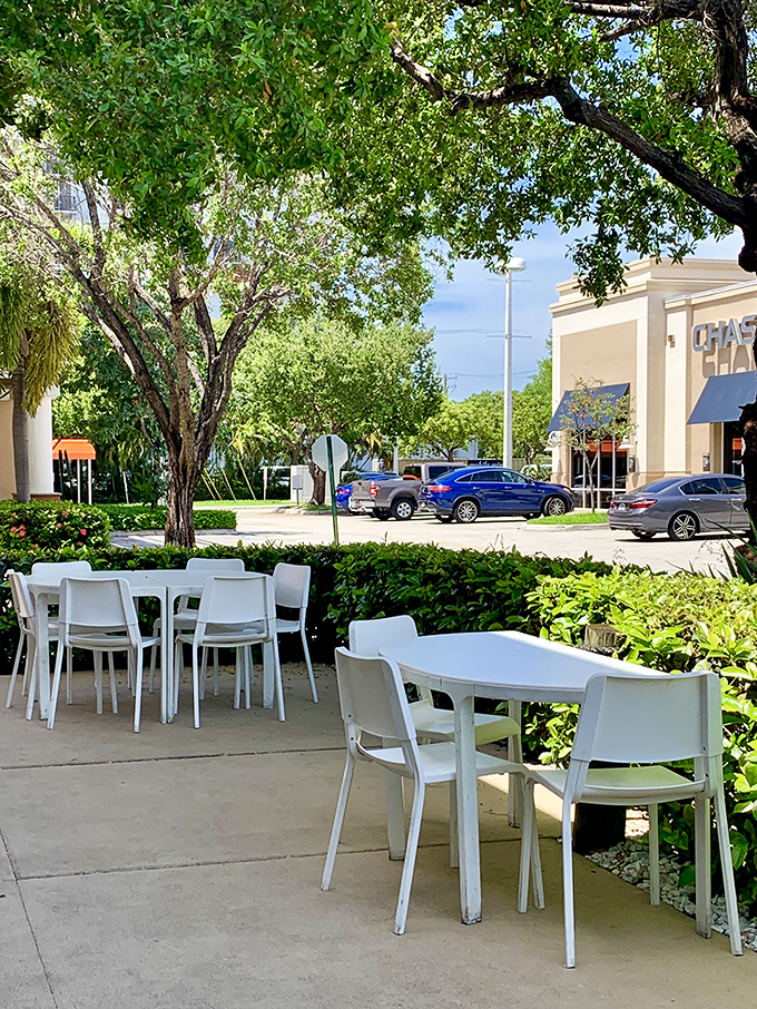 Florida dining at its most pleasant: outdoor tables nestled among greenery. Where lunch comes with a side of sunshine and gentle breezes.