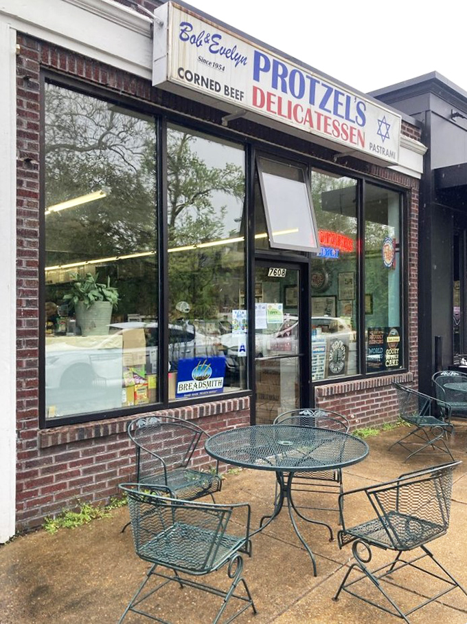 Al fresco dining, deli-style. These unassuming metal tables have hosted more meaningful conversations than most therapists' offices.