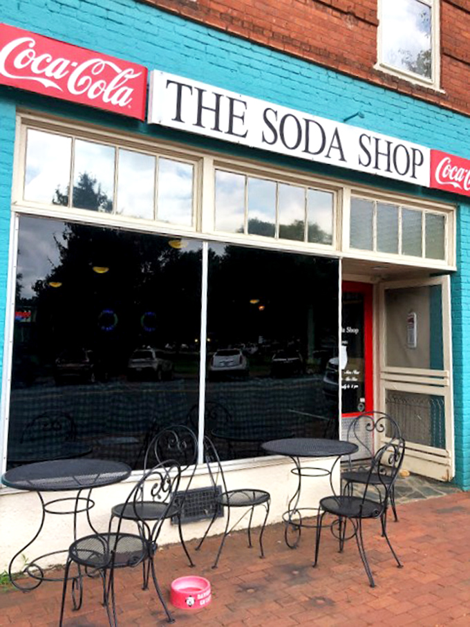 These sidewalk tables aren't just for dining—they're front-row seats to the gentle rhythm of small-town life passing by on brick-lined streets.