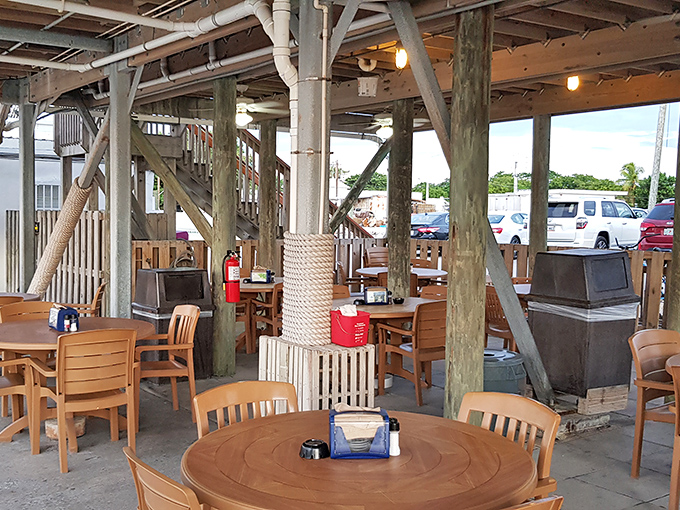 Rustic wooden pillars and casual seating create the perfect unpretentious atmosphere. No white tablecloths needed when the food speaks this loudly.