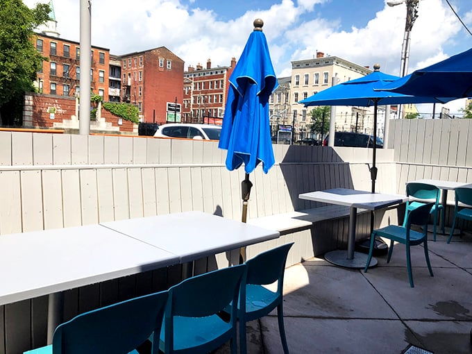 The patio offers urban dining with a side of people-watching. Blue umbrellas stand ready to shield your pancakes from unexpected Cincinnati showers.