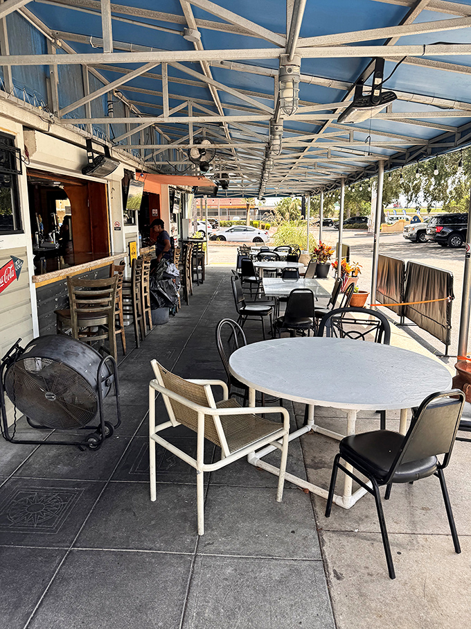 Outdoor seating where Florida breezes enhance every bite. The perfect spot to debate whether to order dessert (spoiler alert: you will).