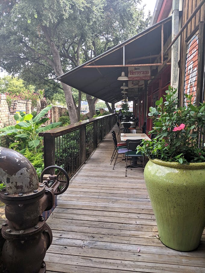 The outdoor seating area offers a peaceful wooden deck retreat, where margaritas taste even better under the Texas sky.