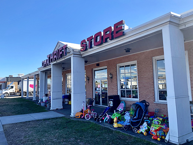 The outdoor display: where children's dreams park themselves before finding new homes. Those ride-on toys have miles of smiles left in them.