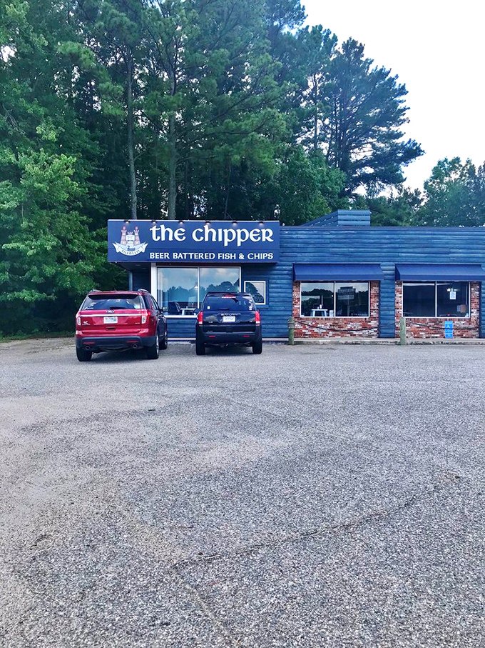 As evening approaches, The Chipper's blue exterior glows like a beacon for hungry travelers. Your fish and chips pilgrimage ends here.