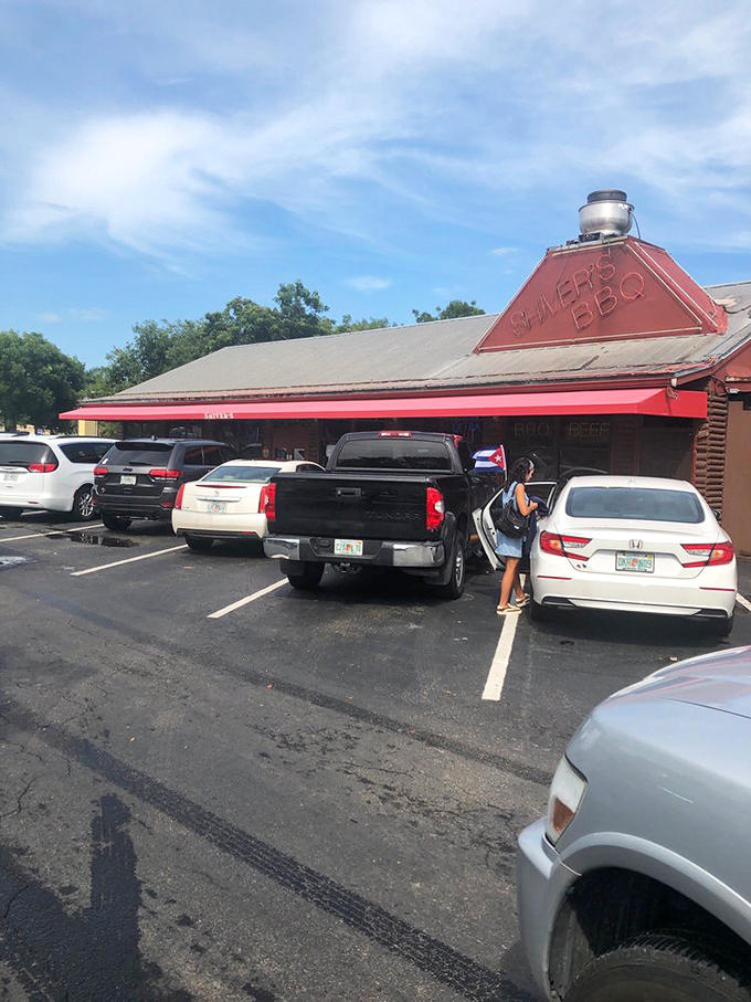 A parking lot that's seen its share of barbecue pilgrimages &ndash; each space a temporary home for vehicles carrying soon-to-be-satisfied customers.
