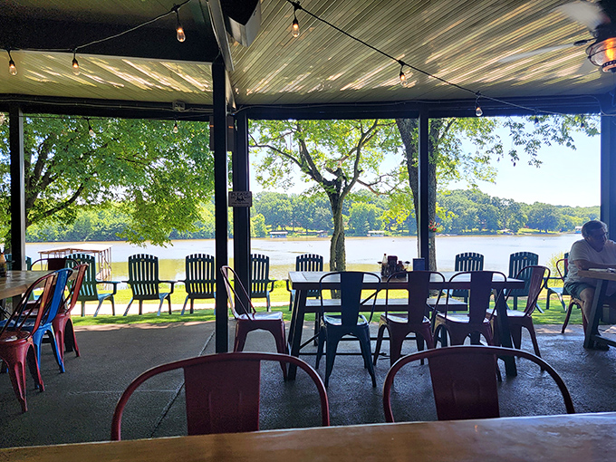 Red chairs invite you to linger by the water, where every table feels like front-row seating to nature's most relaxing show.