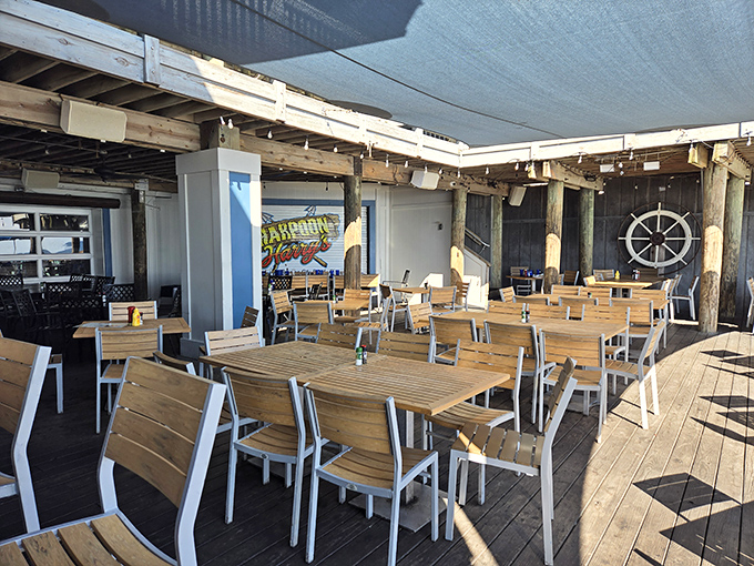 The outdoor deck offers al fresco dining where the sea breeze serves as both appetizer and dessert.