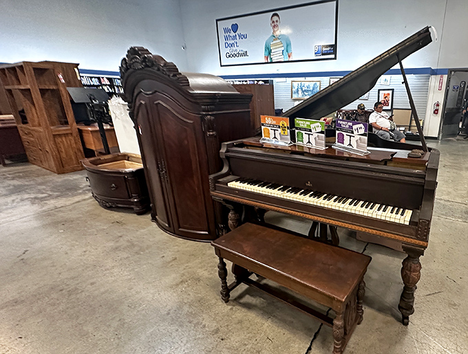 A grand piano stands majestically among more modest furniture finds. For the price of a few piano lessons, the instrument itself could be yours.