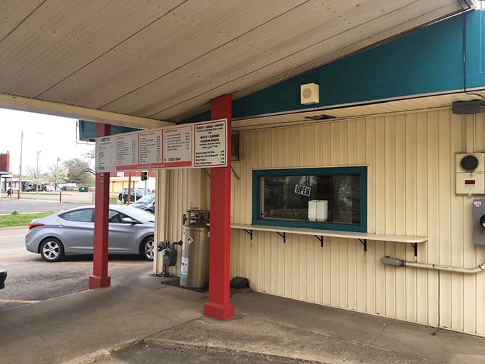 The pick-up window: where dreams come true in grease-spotted paper bags and anticipation builds.