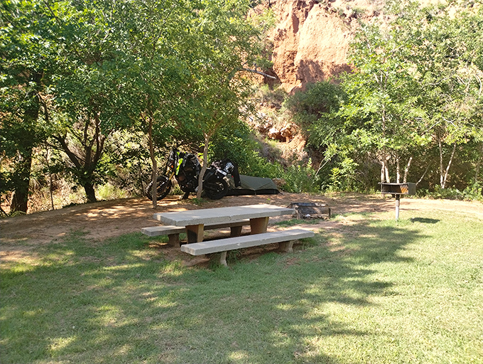 Picnic with a side of prehistoric ambiance. This shaded table offers the perfect spot to contemplate the millions of years of geological history surrounding your sandwich.