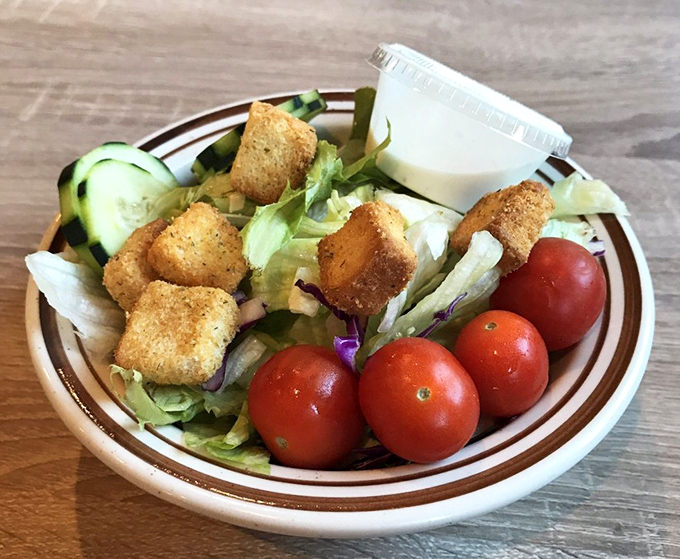 Even the salad gets special treatment here—crisp, colorful, and just enough to convince yourself you're eating a "balanced" meal.