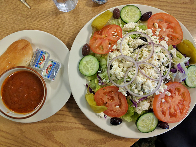 A Greek salad that could make Zeus himself descend from Olympus, crowned with feta and flanked by a side of comforting soup.