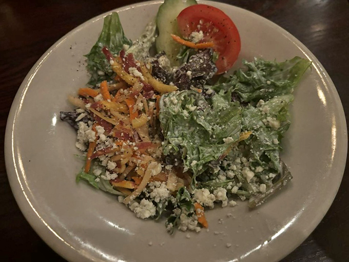 Even the salads command respect here—fresh, crisp, and adorned with just enough blue cheese to remind you this is still steakhouse territory.