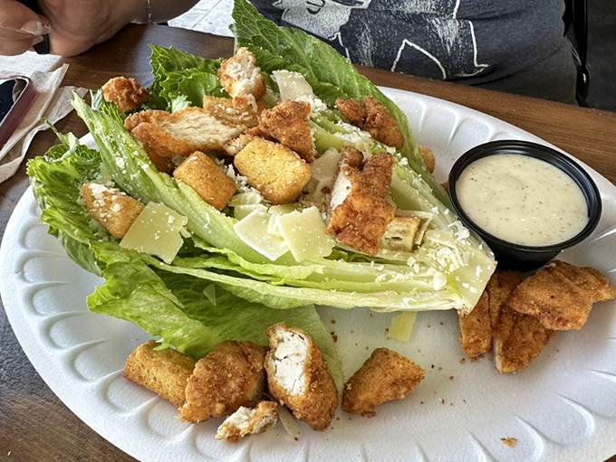 A Caesar salad that doesn't mess around&mdash;crisp romaine, house-made croutons, and enough fried seafood to make a nutritionist look the other way.