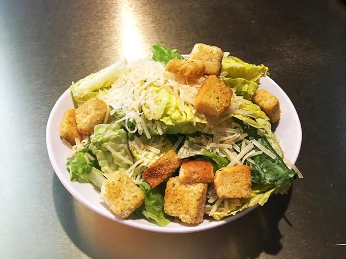 A Caesar salad that Caesar himself would approve &ndash; crisp romaine, perfect croutons, and enough parmesan to make an Italian grandmother nod appreciatively.