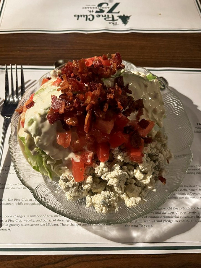 The wedge salad&mdash;that steakhouse classic where iceberg lettuce finally gets its moment to shine beneath a blanket of blue cheese and bacon.