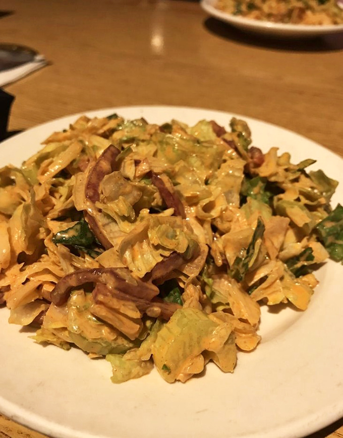 Fresh salad provides the perfect crisp counterpoint to all that glorious beef you're about to devour.