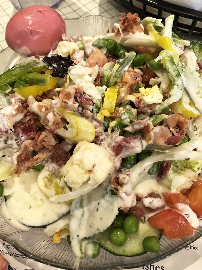 A salad that refuses to be an afterthought &ndash; loaded with fresh vegetables, eggs, and enough bacon to make you temporarily forget you're eating something healthy.