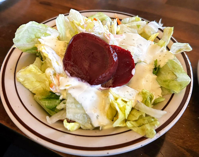 Fresh salad with that signature pickled beet that adds tangy contrast to all the rich, smoky flavors ahead.