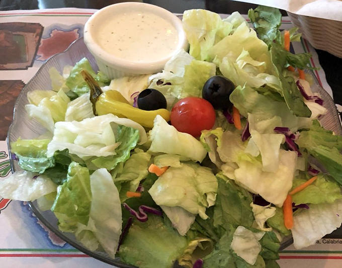 A salad that doesn't apologize for being simple. Fresh, crisp, and ready to balance out all that glorious cheese you're about to consume.