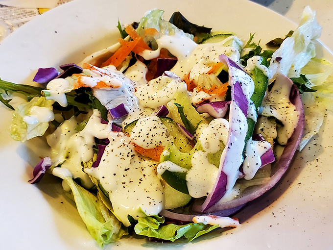 A garden salad that doesn't apologize for being healthy in a temple of comfort food. The creamy dressing is the diplomatic compromise.