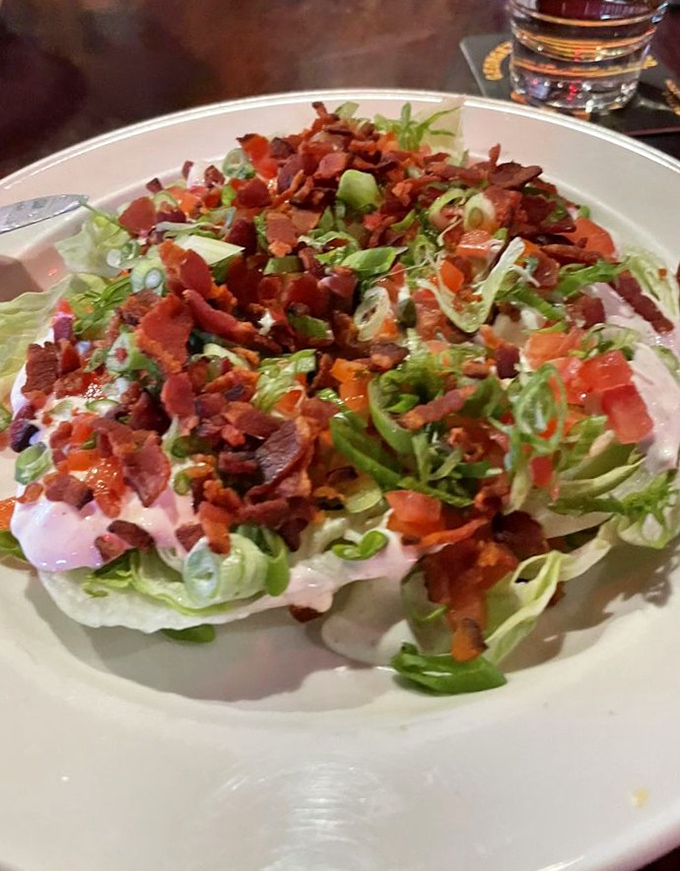 Not just a token salad&mdash;a legitimate contender. Crisp iceberg, bacon bits, and house-made dressing prove Slim's excels beyond the chili realm.