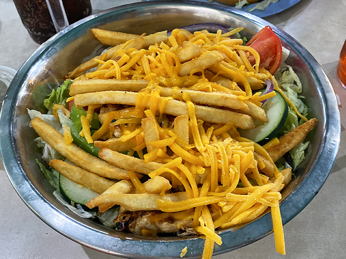 Not your average salad &ndash; this Pittsburgh-style creation throws convention to the wind by crowning fresh greens with crispy fries and a shower of cheese.
