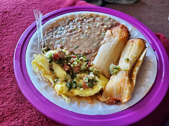 Breakfast of champions: eggs mingling with fresh pico de gallo alongside perfect tamales. This plate doesn't just start your day&mdash;it makes your whole week better.