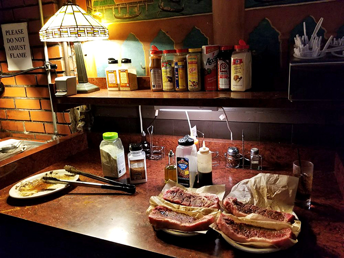 The seasoning station stands ready with its arsenal of flavor enhancers, where your steak's destiny awaits your personal touch.