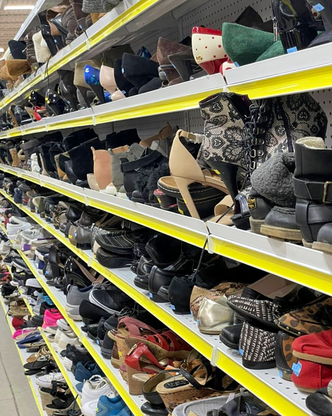 Shoe shelves stretch endlessly upward, where Cinderella moments happen daily without the fairy godmother's expense account.
