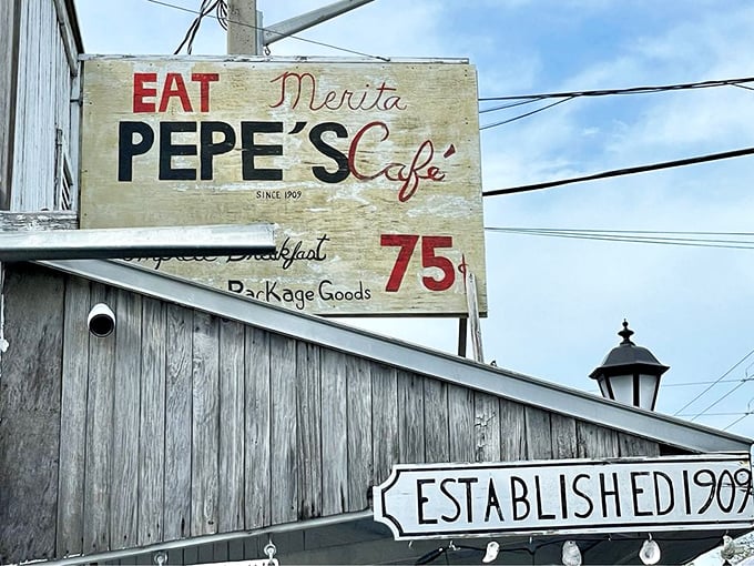 The weathered sign announces "EAT" with the confidence of a place that's been satisfying hungry visitors since 1909.