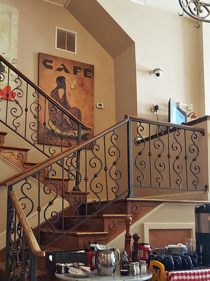 Wrought iron railings curve like musical notes up the staircase, setting the stage for the symphony of flavors waiting at your table.