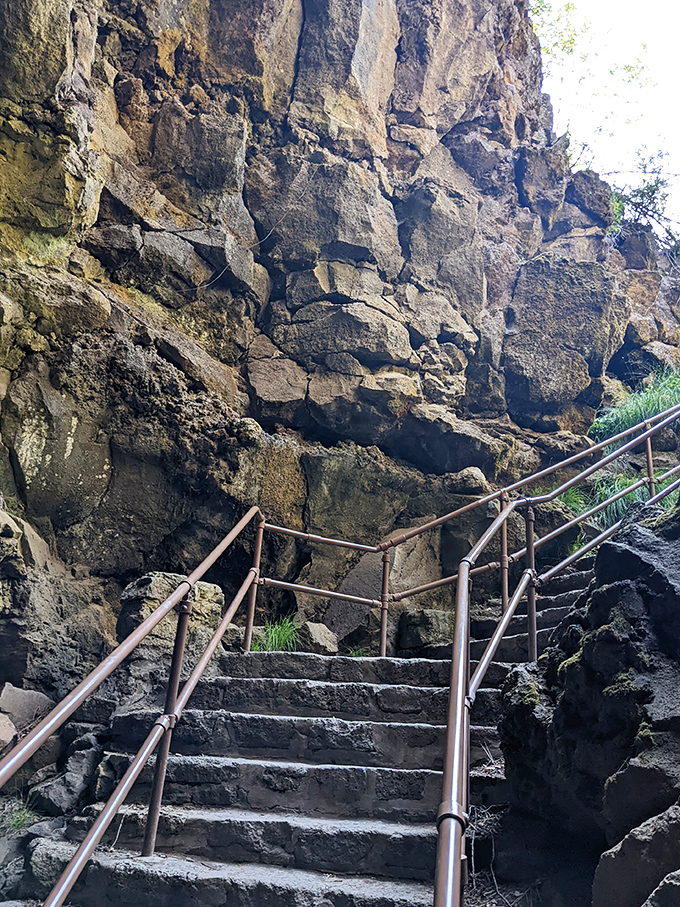 Stone steps lead adventurers into the earth's embrace. This carefully constructed stairway bridges the gap between our world and the subterranean realm created by ancient lava flows.